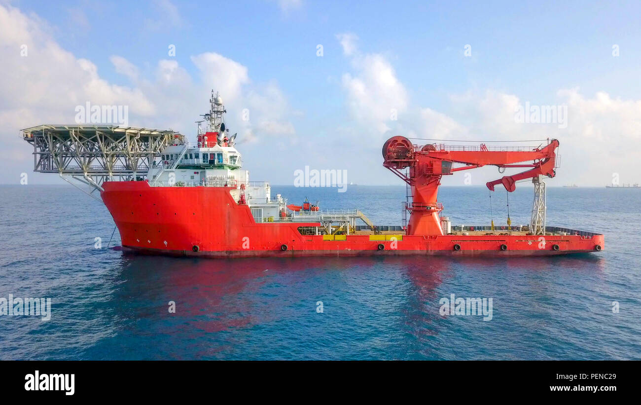 Aerial image of a Medium size red Offshore supply ship with a Helipad ...