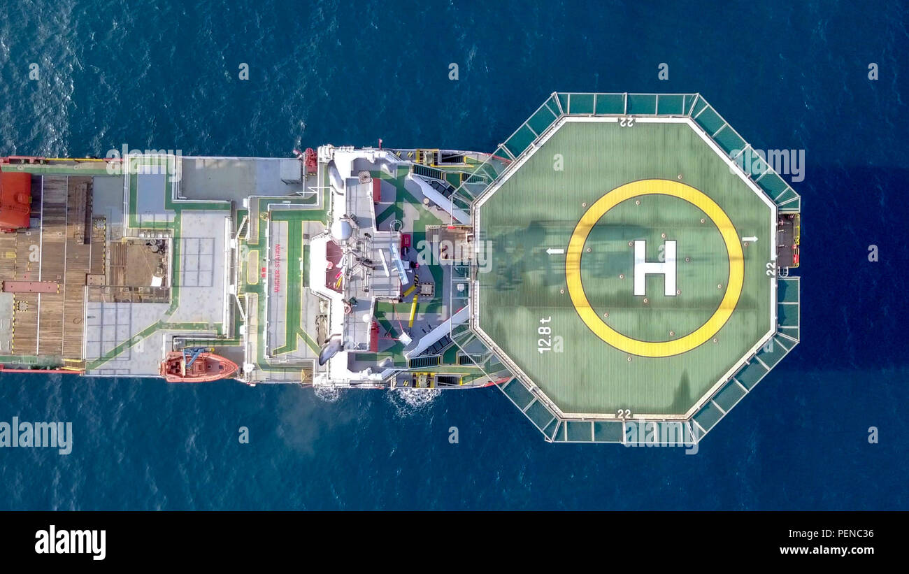 Aerial image of a Medium size red Offshore supply ship with a Helipad ...