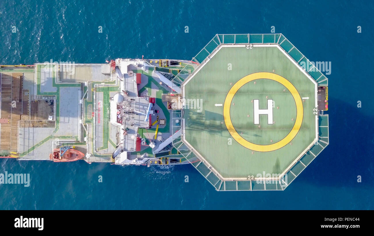 Aerial image of a Medium size red Offshore supply ship with a Helipad ...