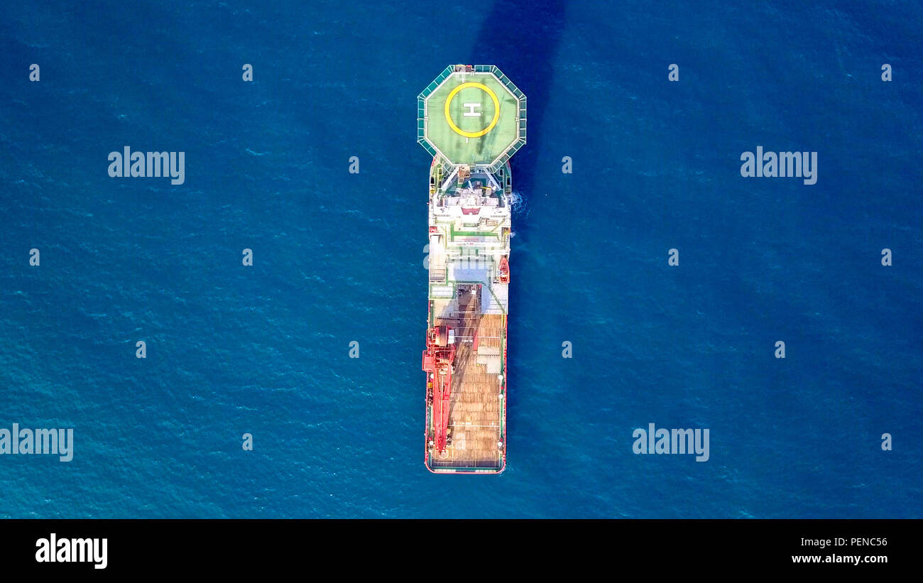 Aerial image of a Medium size red Offshore supply ship with a Helipad ...