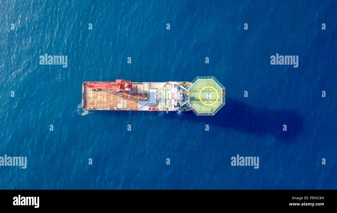 Aerial image of a Medium size red Offshore supply ship with a Helipad ...