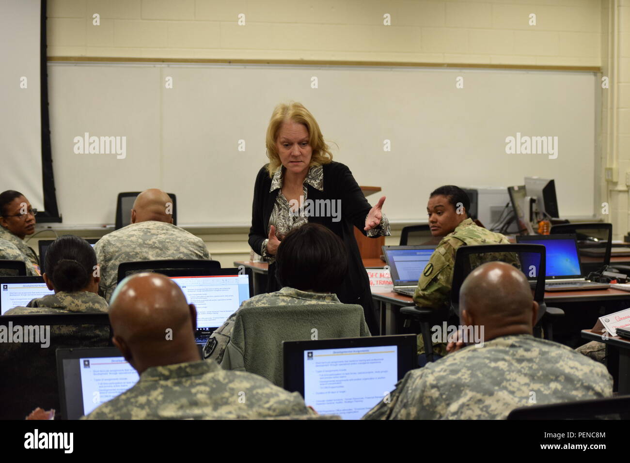 Beryl Hancock (center), chief, Manpower Policy, Plans and Program and ...