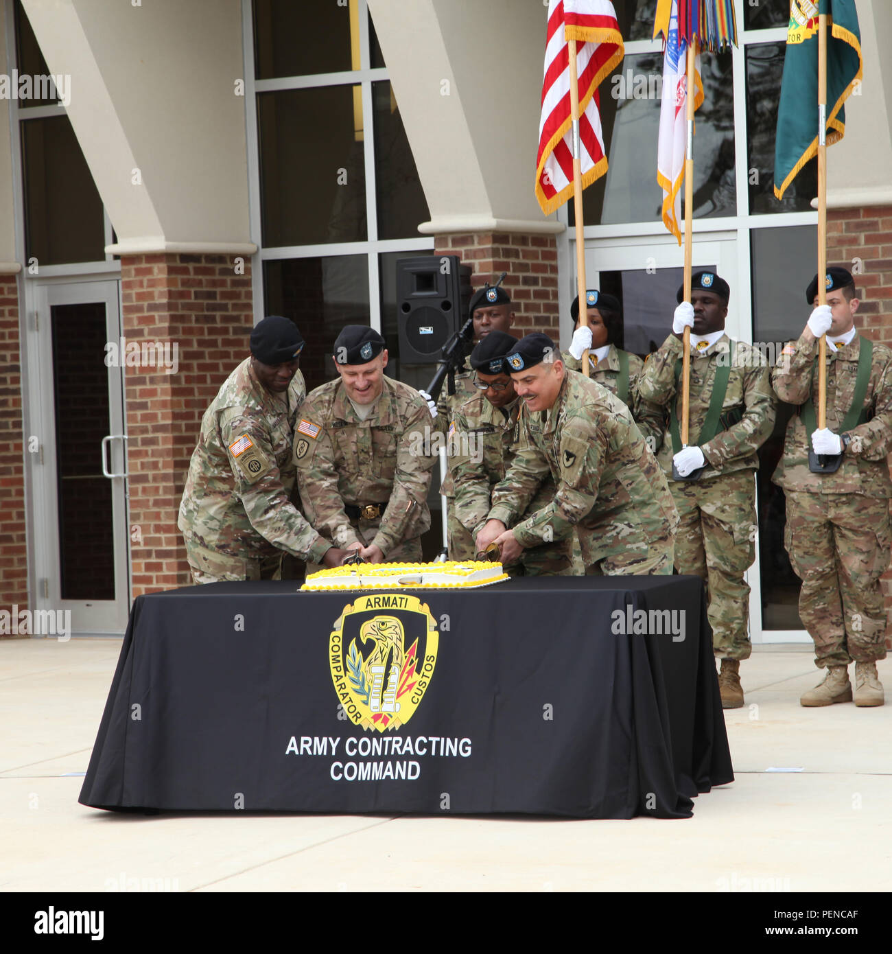 U.S. Army Contracting Command leadership cut the cake during the ribbon ...
