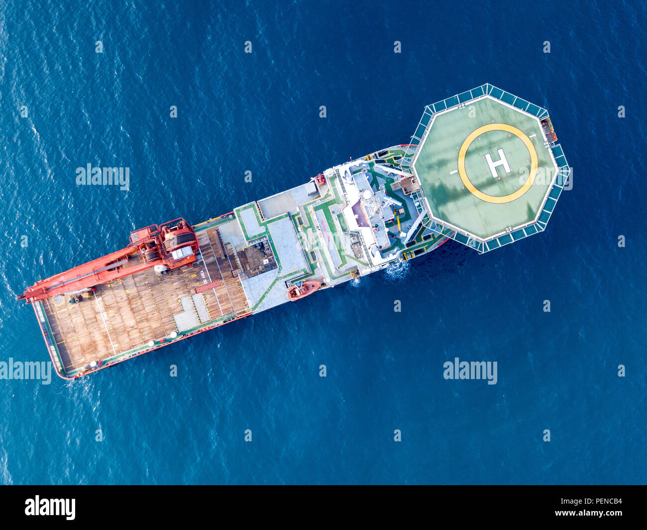 Aerial image of a Medium size red Offshore supply ship with a Helipad ...