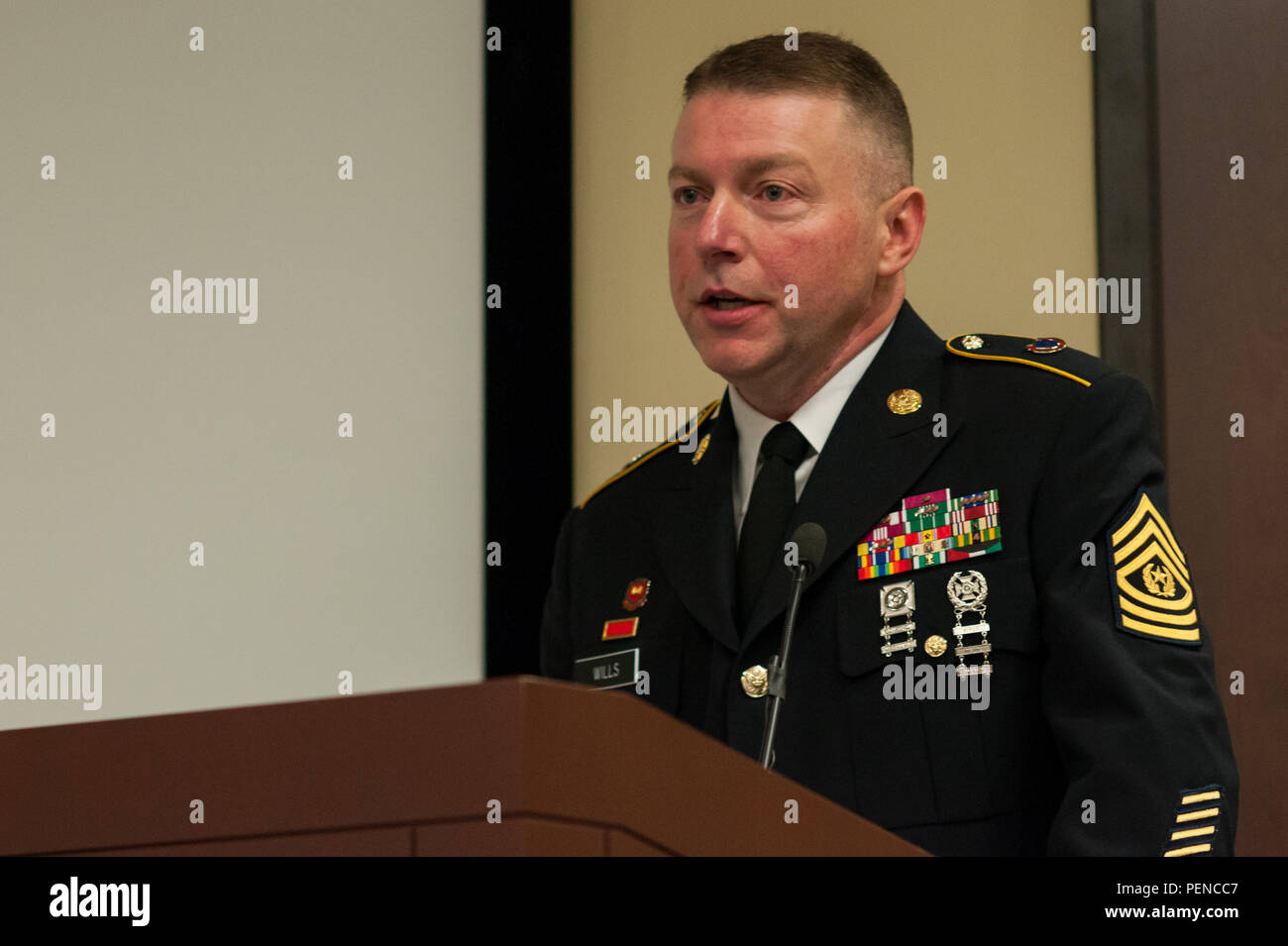 Command Sgt. Maj. James P. Wills addresses the audience during a change ...