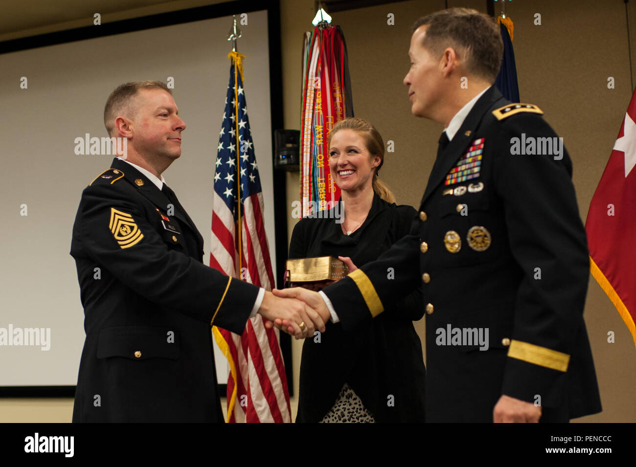 Command Sgt. Maj. James P. Wills is congratulated by Lt. Gen. Jeffrey W ...