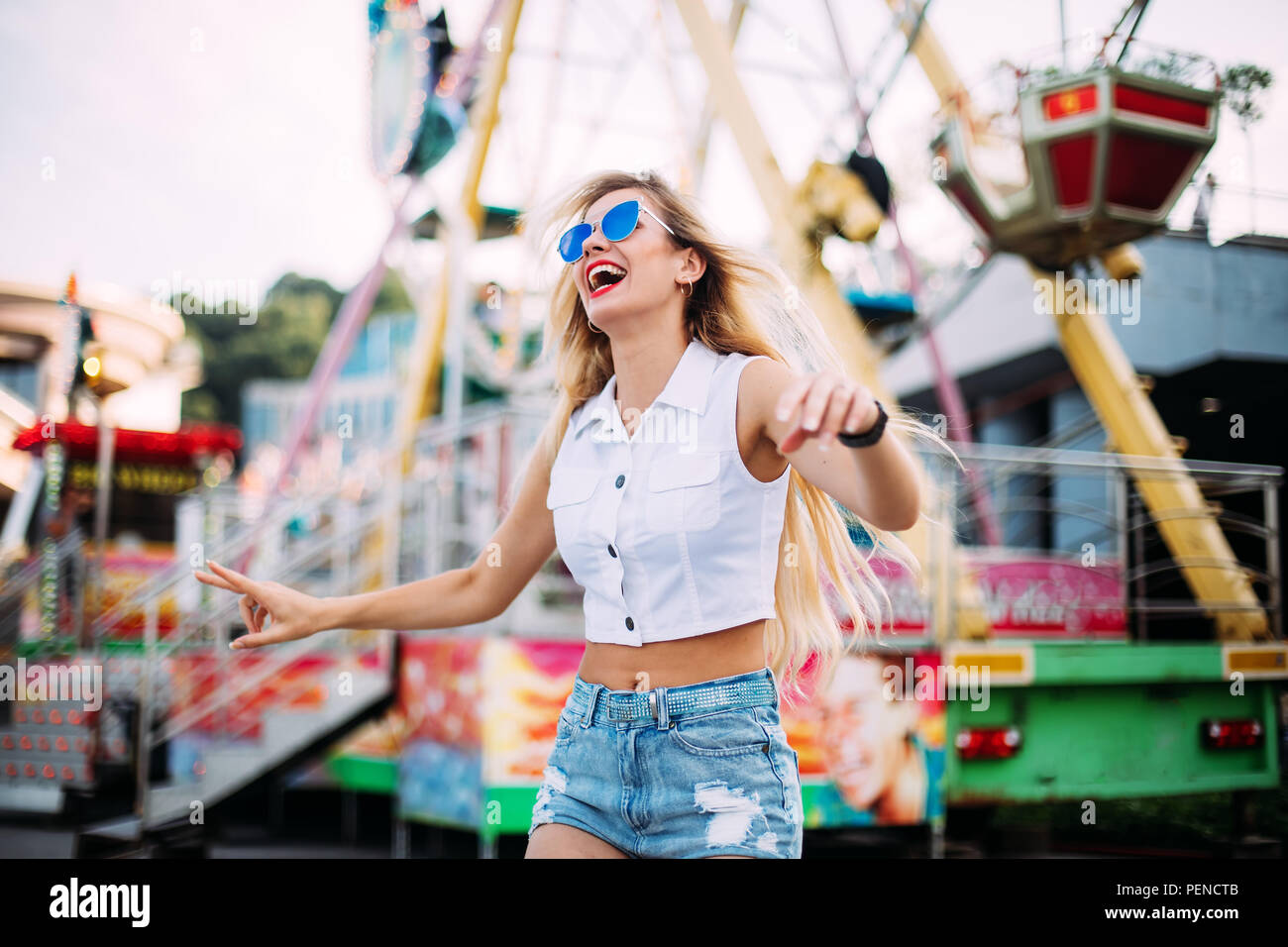Woman wearing short shorts hi-res stock photography and images - Alamy