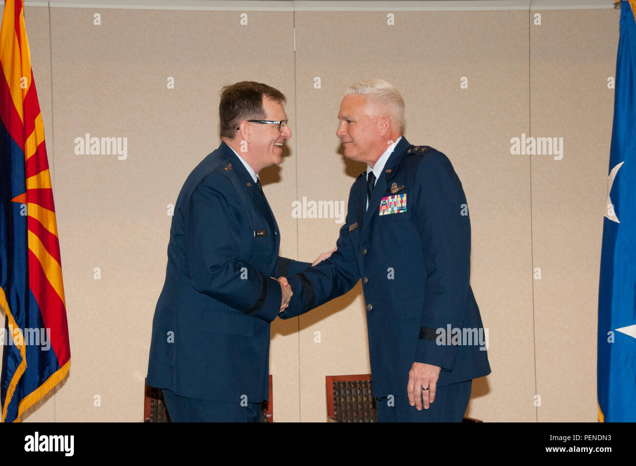 Maj. Gen. Edward Maxwell shakes hands with Maj. Gen. Michael T. McGuire ...