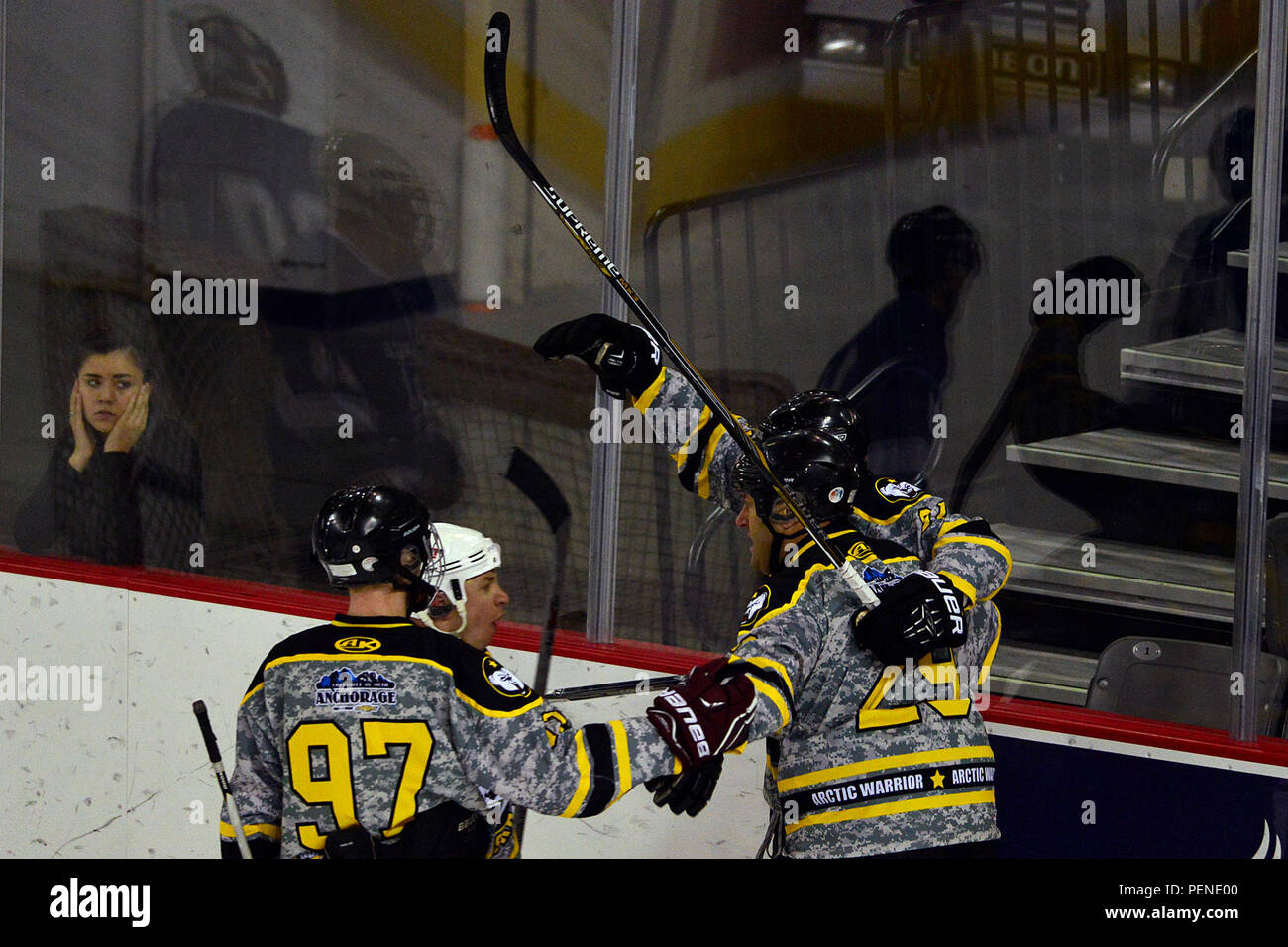 Army players celebrate Staff Sgt. Cameron Penney's third-period goal ...
