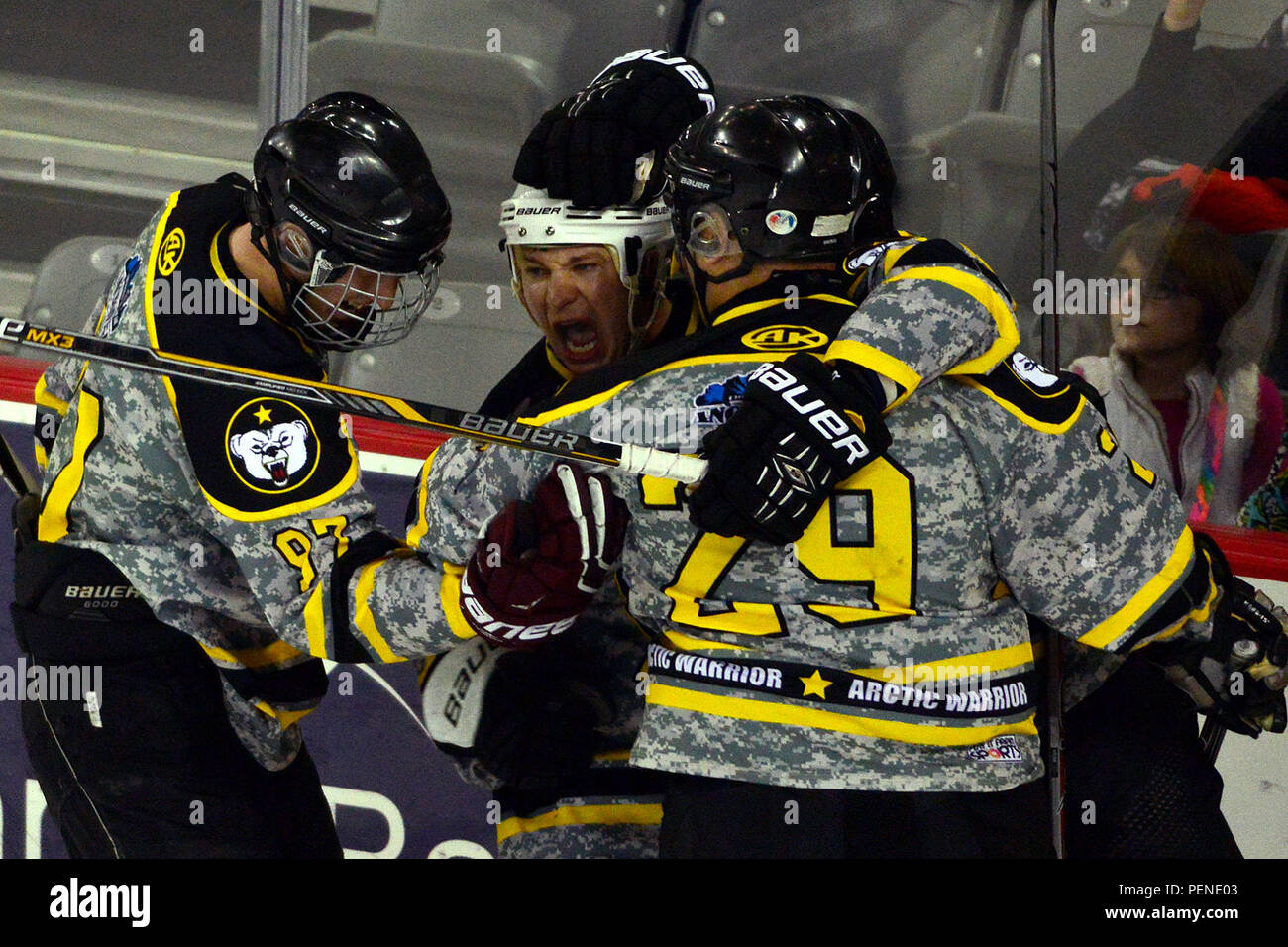 Army players celebrate Staff Sgt. Cameron Penney's third-period goal ...