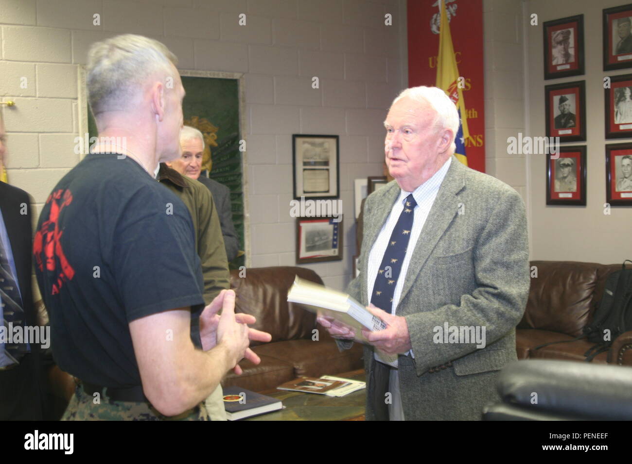 Kemp Norman, a former Marine, presents an original copy of "Bless 'Em ...