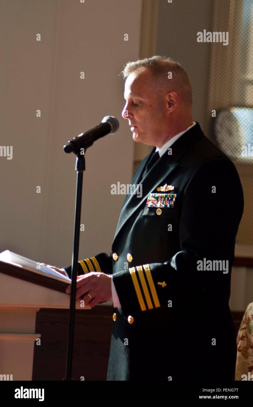 Commander Robert J. Etheridge, deputy command chaplain, gave a opening ...