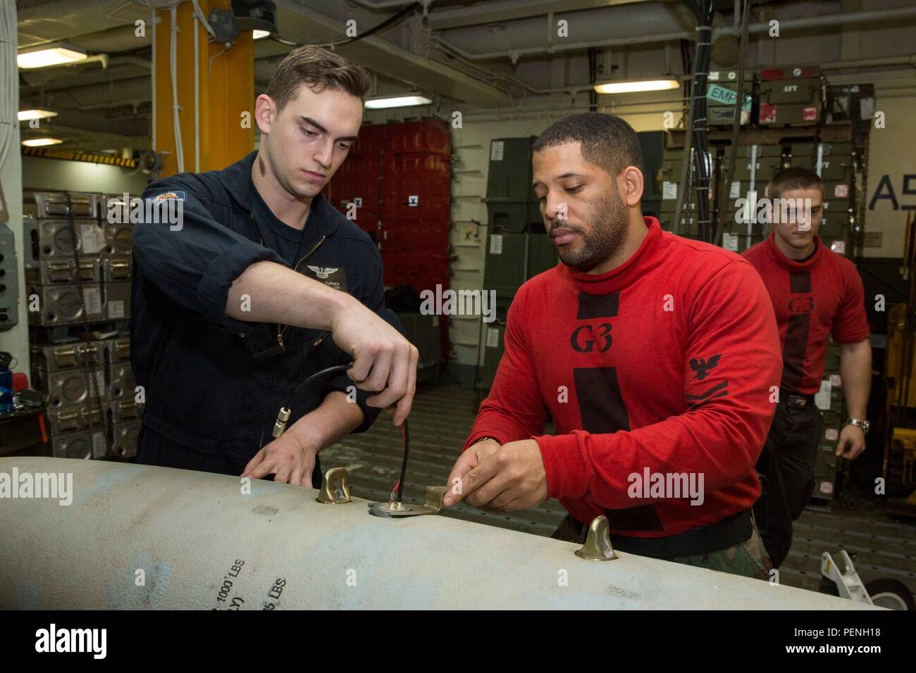 Aviation ordnance personnel install an MK-122 safety switch on a GBU-32 ...
