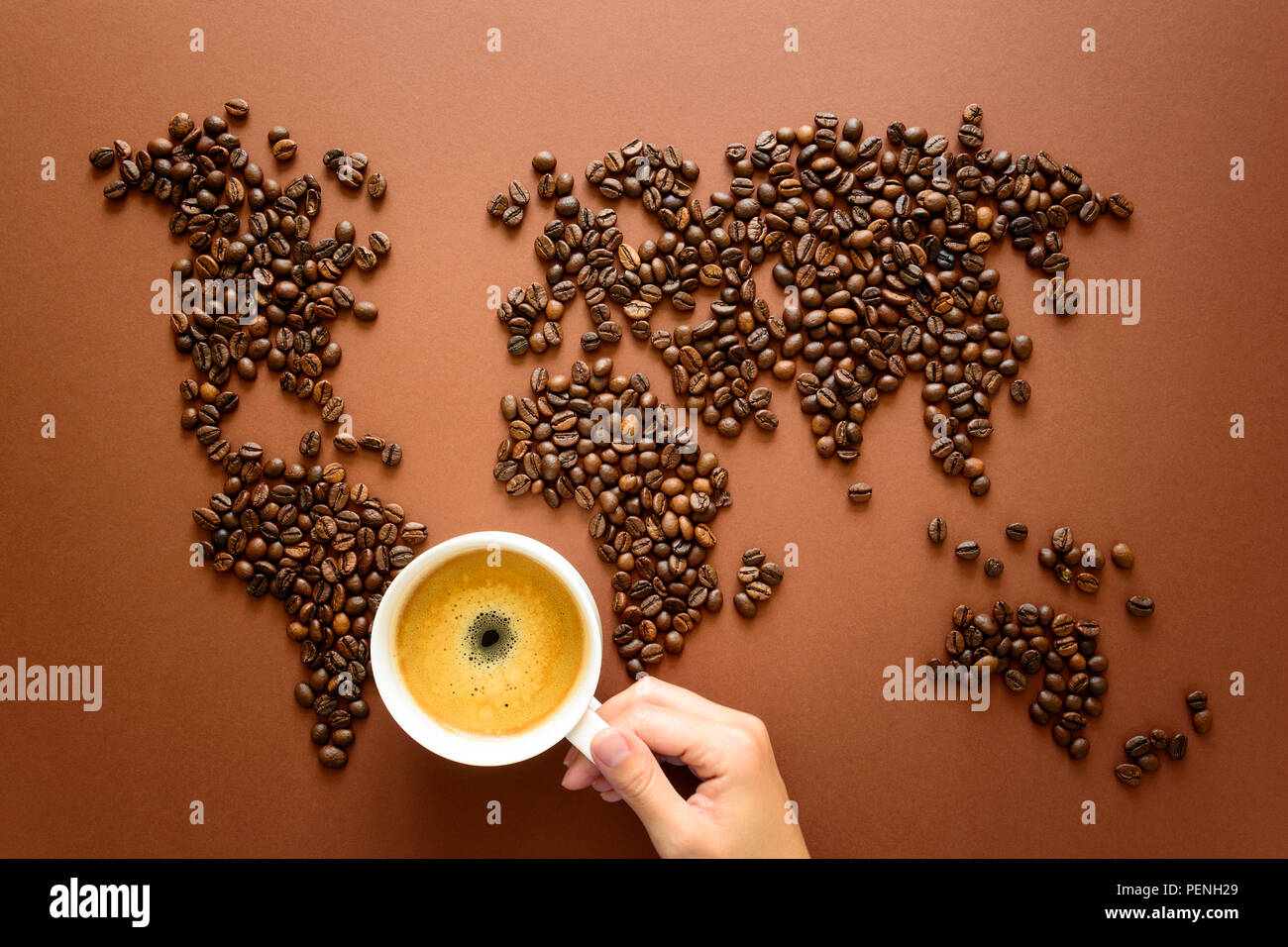 Map of the world made of roasted arabica coffee beans on brown paper ...
