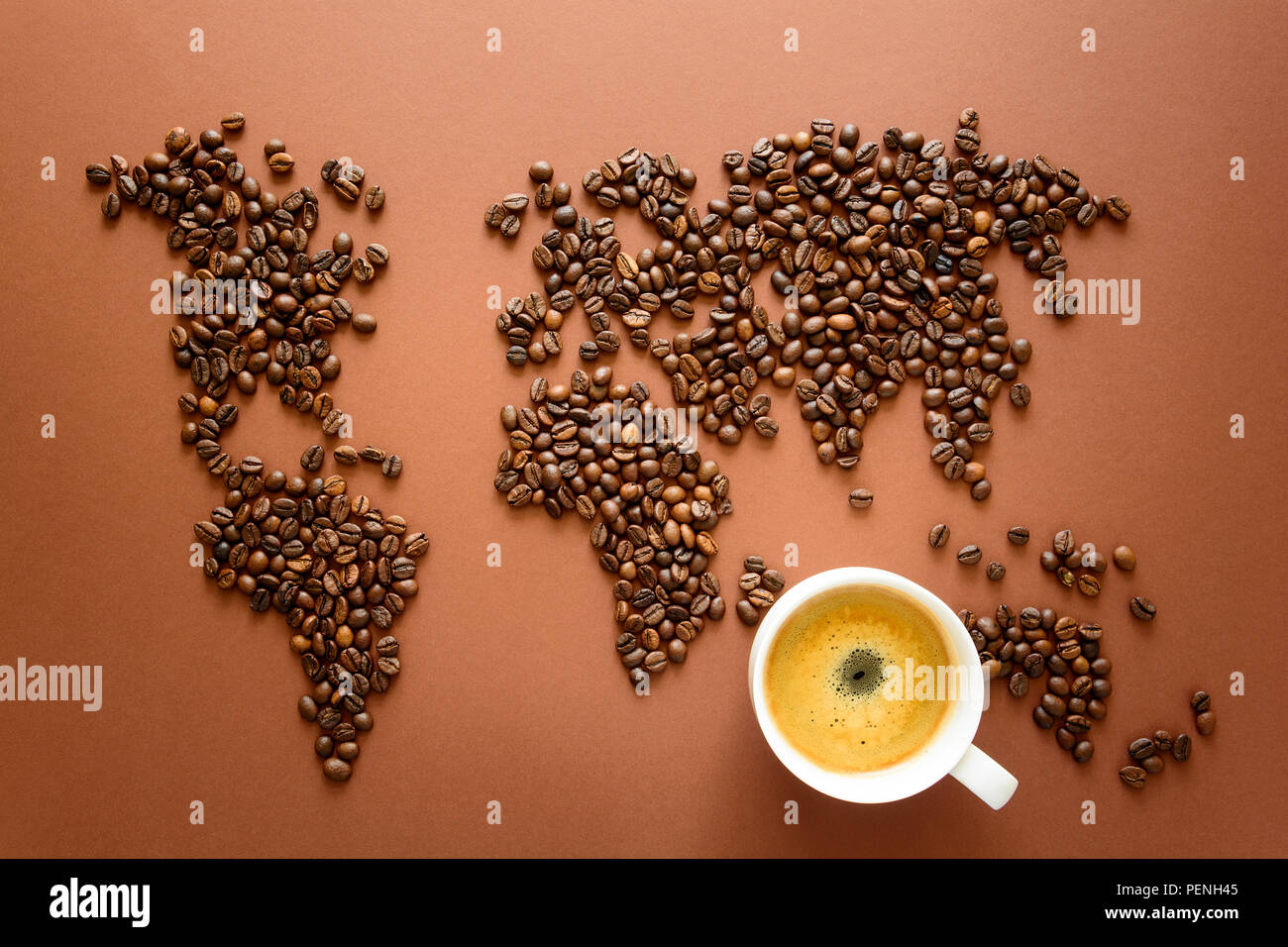 Map of the world made of roasted arabica coffee beans on brown paper ...