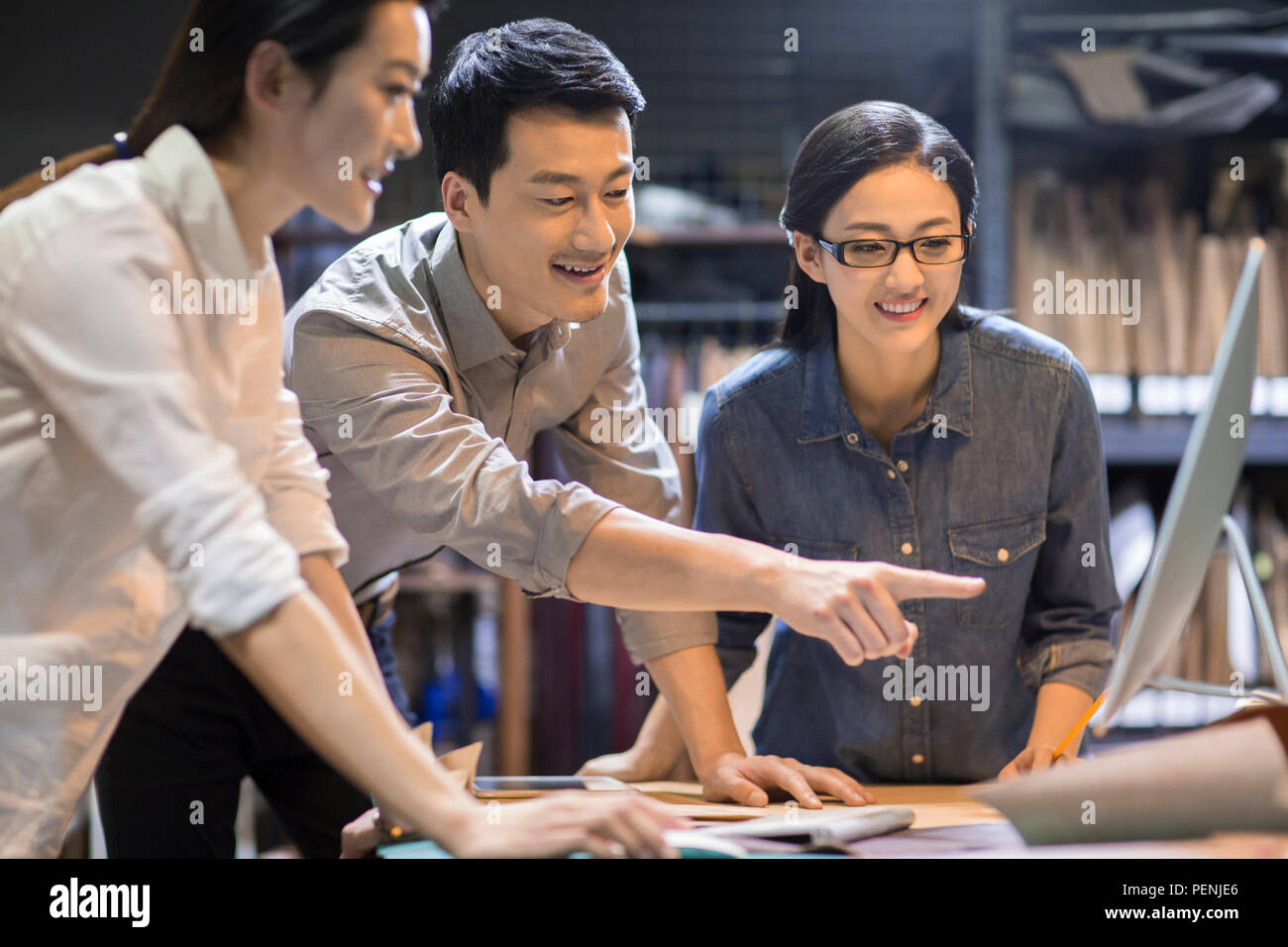 Confident leather craftspeople working in studio Stock Photo - Alamy