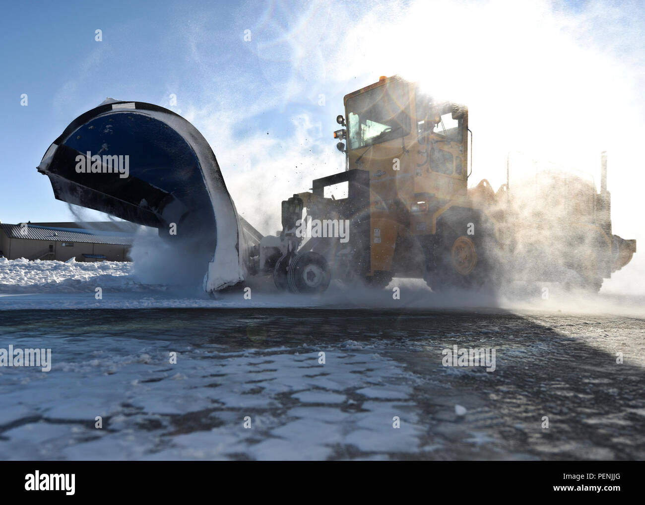 A member of the 28th Civil Engineering Squadron operates a plow to push ...
