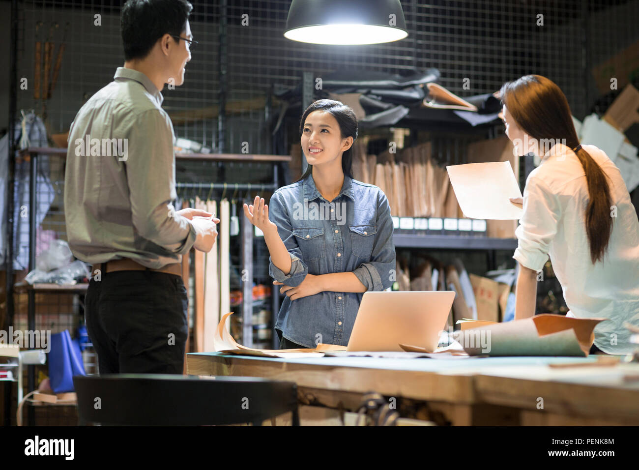 Confident leather craftspeople working in studio Stock Photo - Alamy