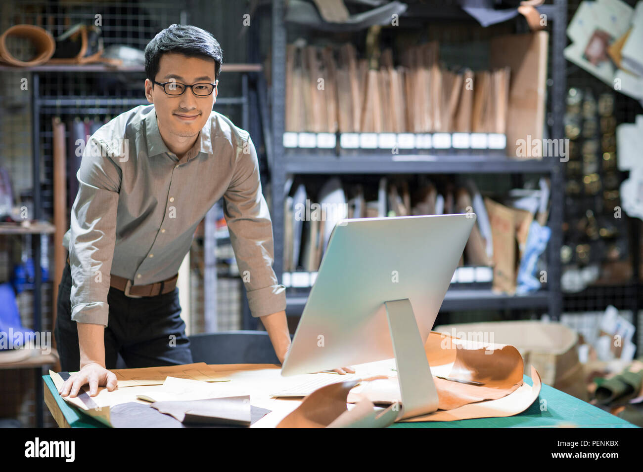 Young man using computer in studio Stock Photo - Alamy