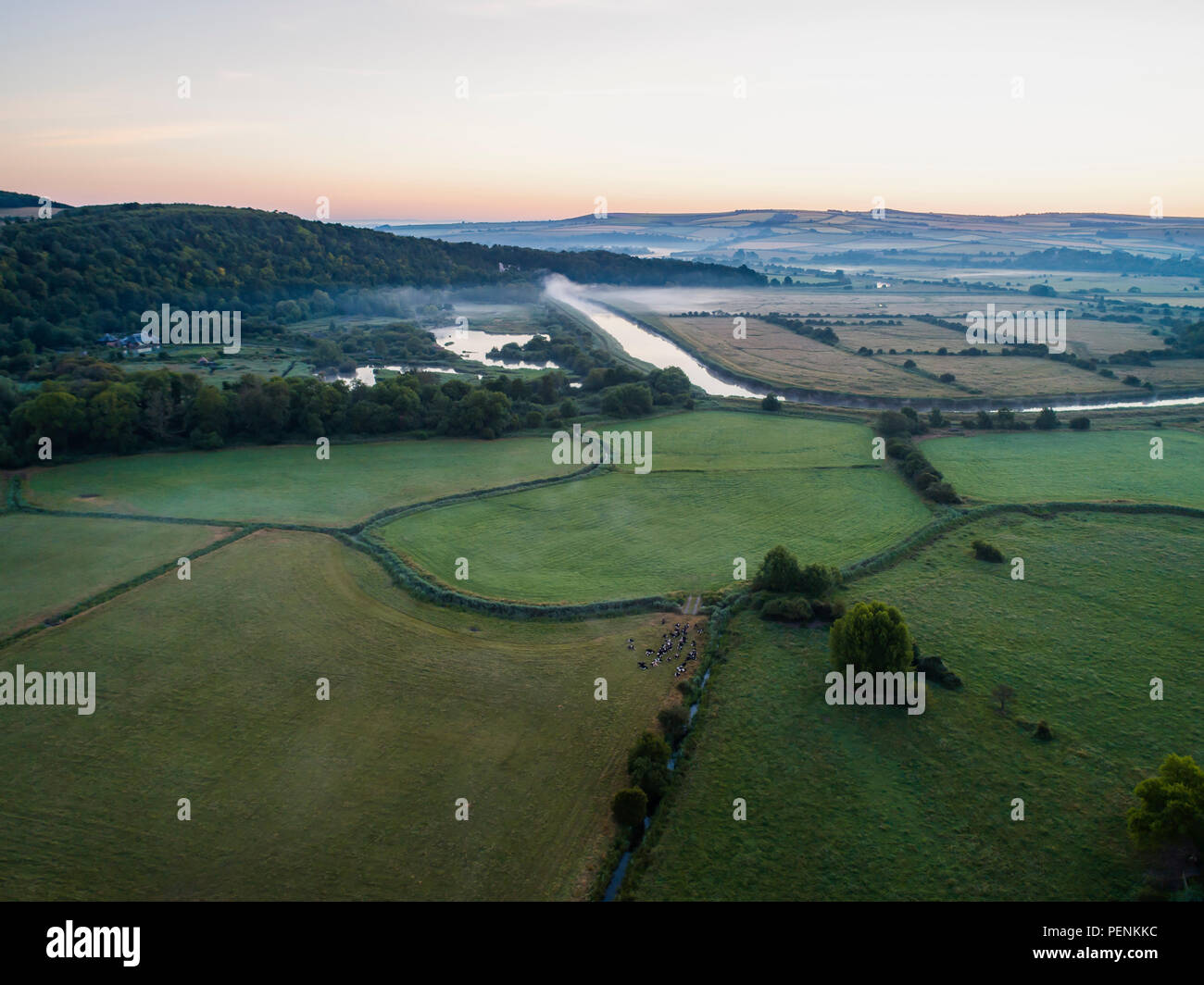 Drone image of a misty dawn English landscape as the sunrises in West ...