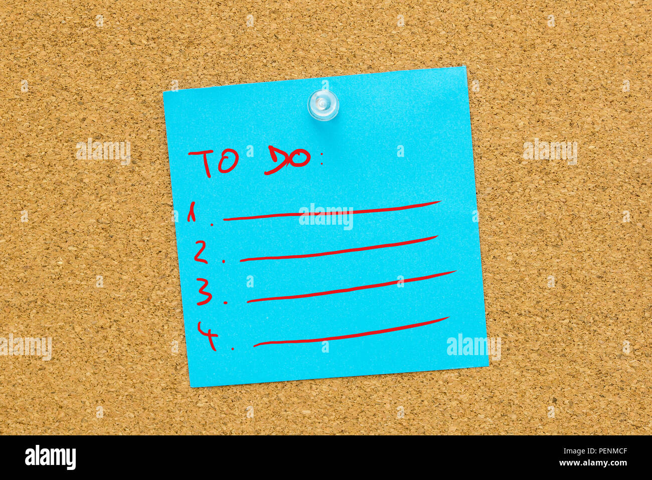 To do list on blue post it paper pinned on a cork bulletin board Stock ...