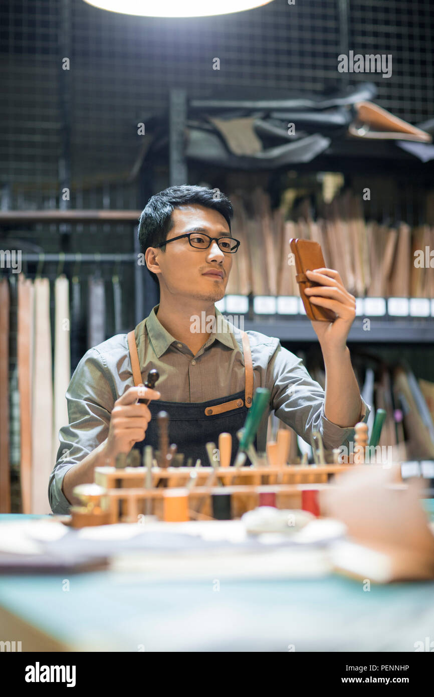 Adult craftsman in glasses sitting hi-res stock photography and images ...