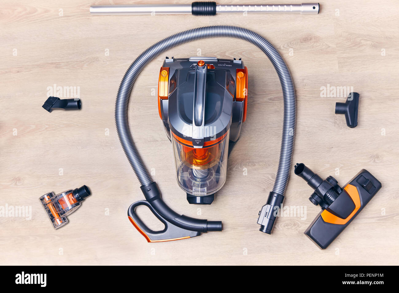 Top view of a modern vacuum cleaner with a container with nozzles and a ...