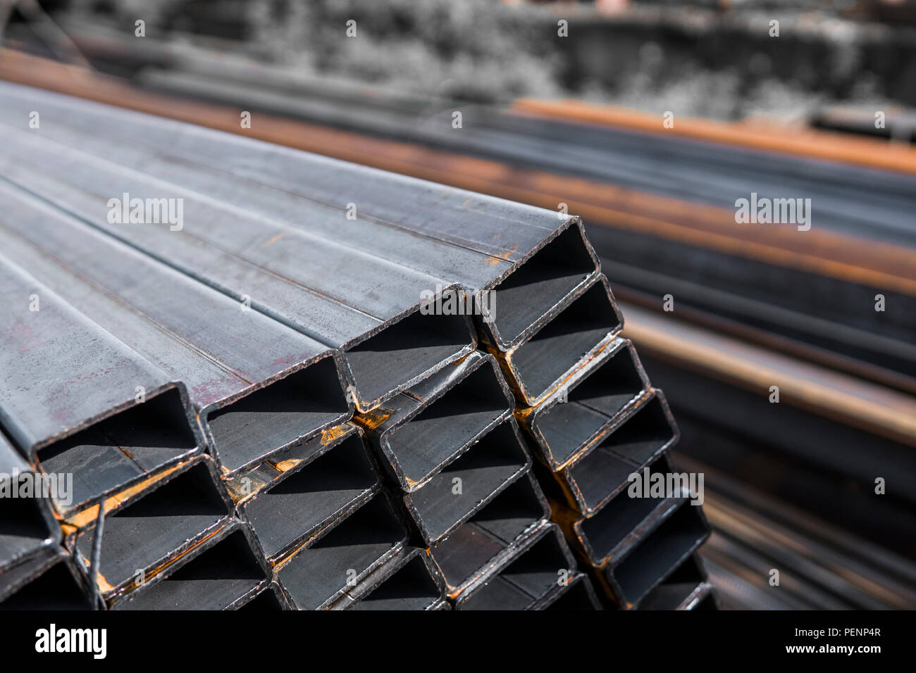 Square flat-rolled pipe metal profile in packs at the warehouse of ...