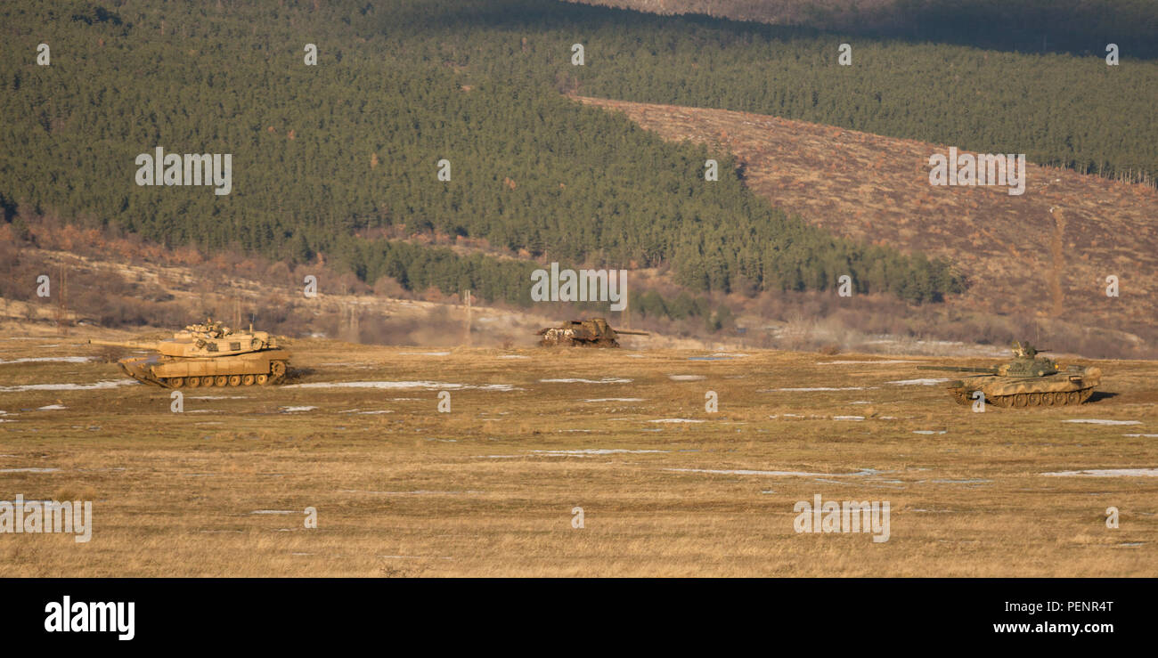U.S. Marine M1A1 Abrams tanks and Bulgarian T-72 tanks conduct maneuver ...
