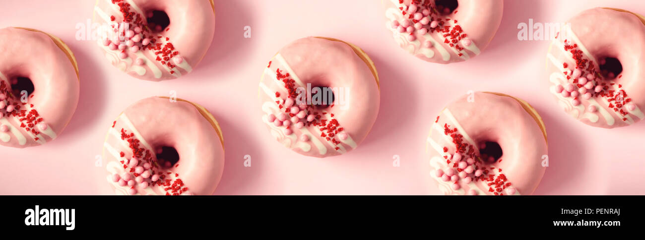 Flat lay donuts pattern on pastel pink background. Top view. Square ...