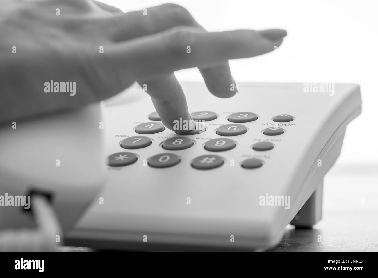 Female hand dialing telephone number Black and White Stock Photos ...