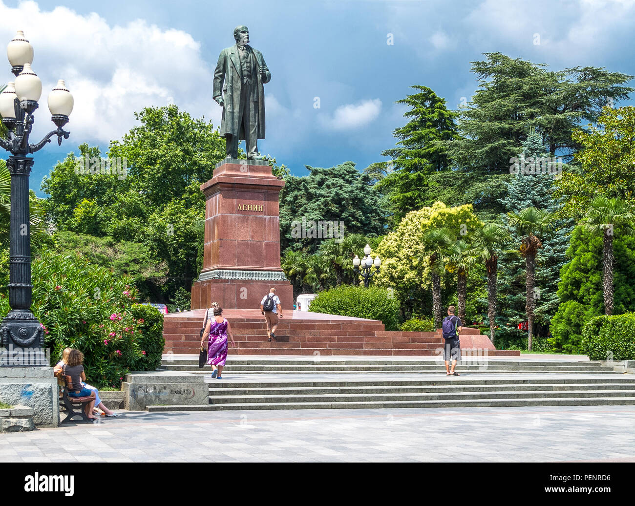 Jalta, Ukraine - August 16, 2012: Local people under the Lenin monument ...