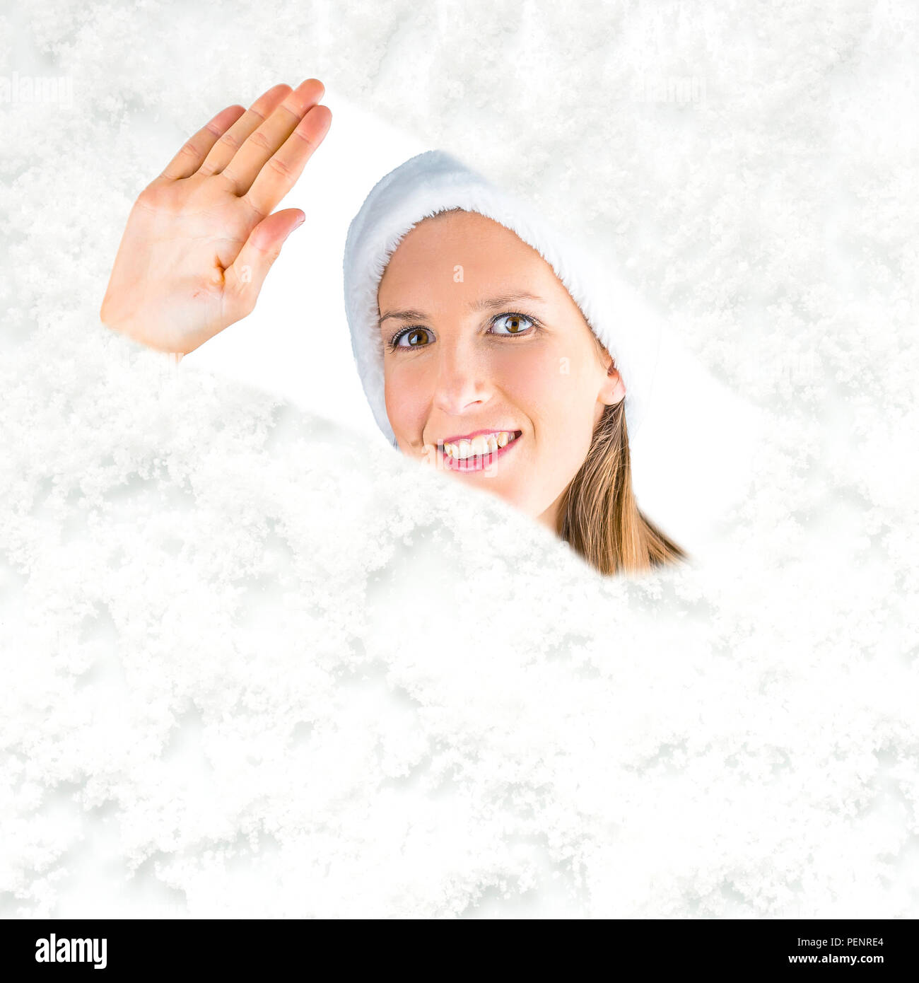 Miss santa clearing snow with a hand wipe from a snowy window and ...
