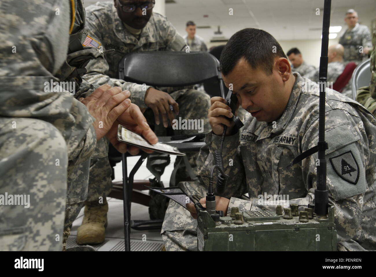 U.S. Army CW2 Eduardo Garcia of the 91st Training Division calls for a ...