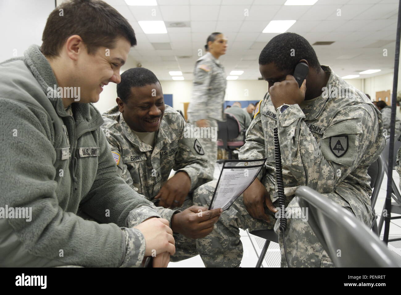 U.S. Army Sgt. Jason Bryan (center) and Spcs. Joseph Zunker (left) and ...