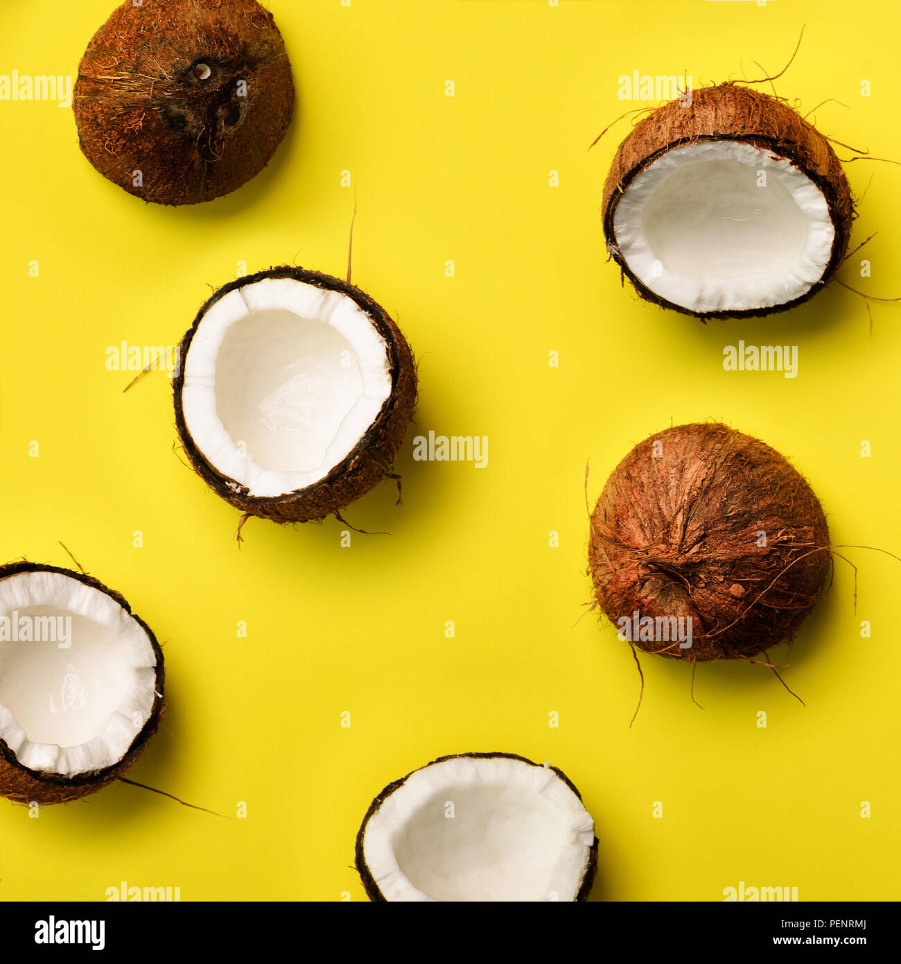 Pattern with ripe coconuts on yellow background. Top View. Copy Space ...