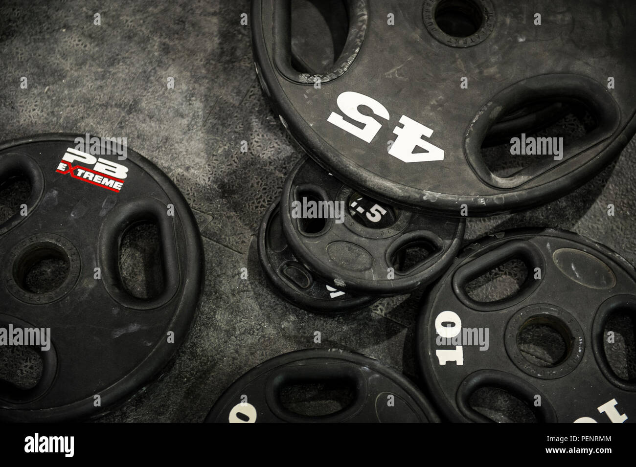 Weights litter the floor during a 400/1,000-pound powerlifting ...