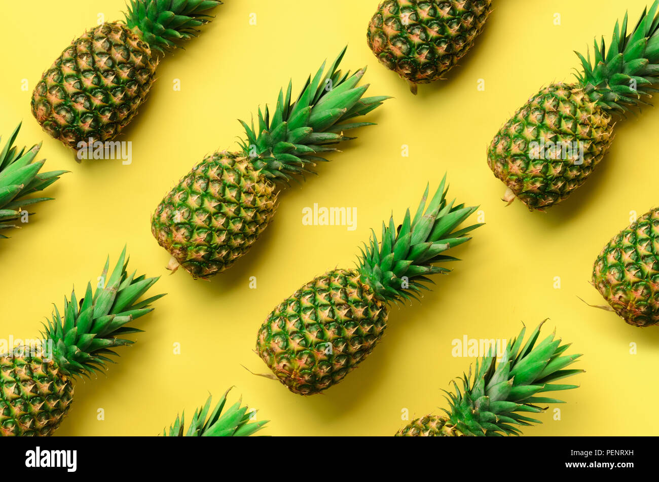 Fresh pineapples on yellow background. Top View. Pop art design ...