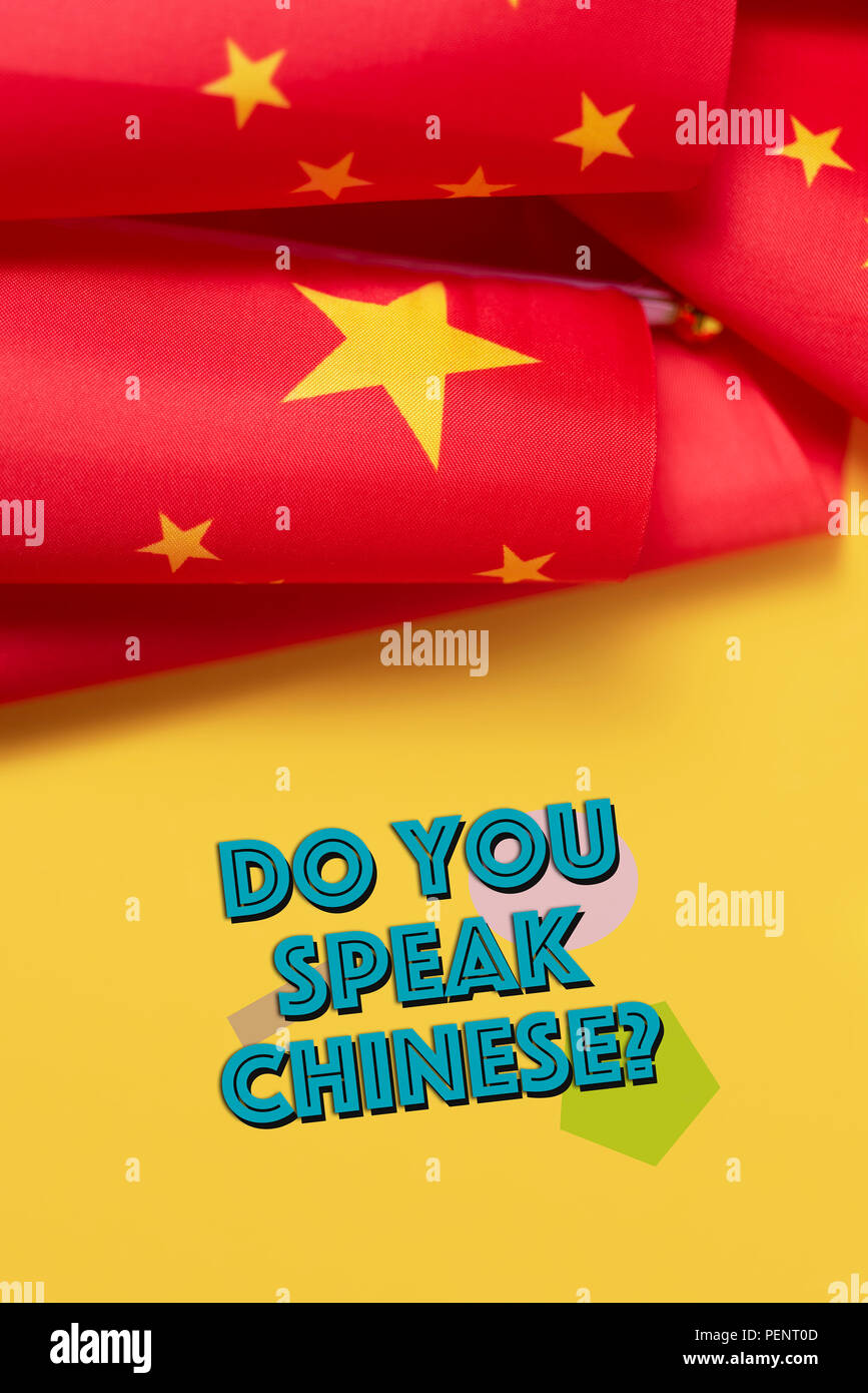 some flags of China and the question do you speak Chinese? on a yellow ...