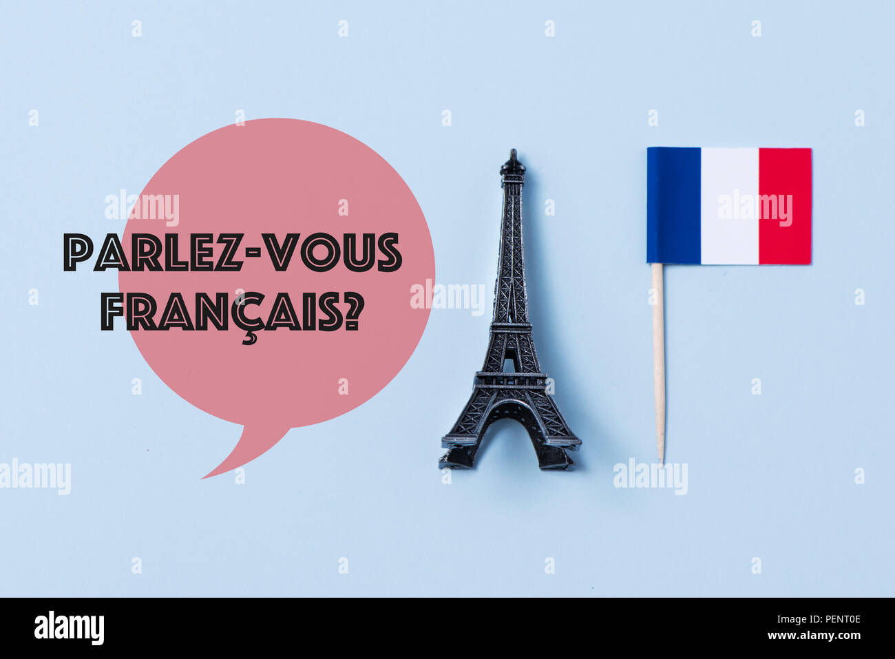 a miniature of the Eiffel Tower, a flag of France and the question ...