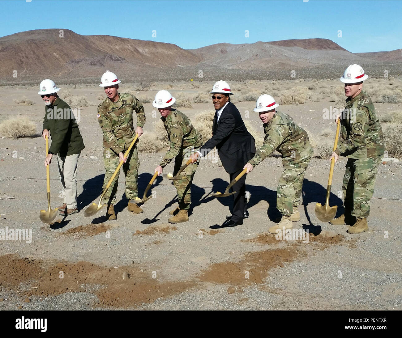 Officials toss ceremonial shovels of dirt for the new MQ-1C Gray Eagle ...