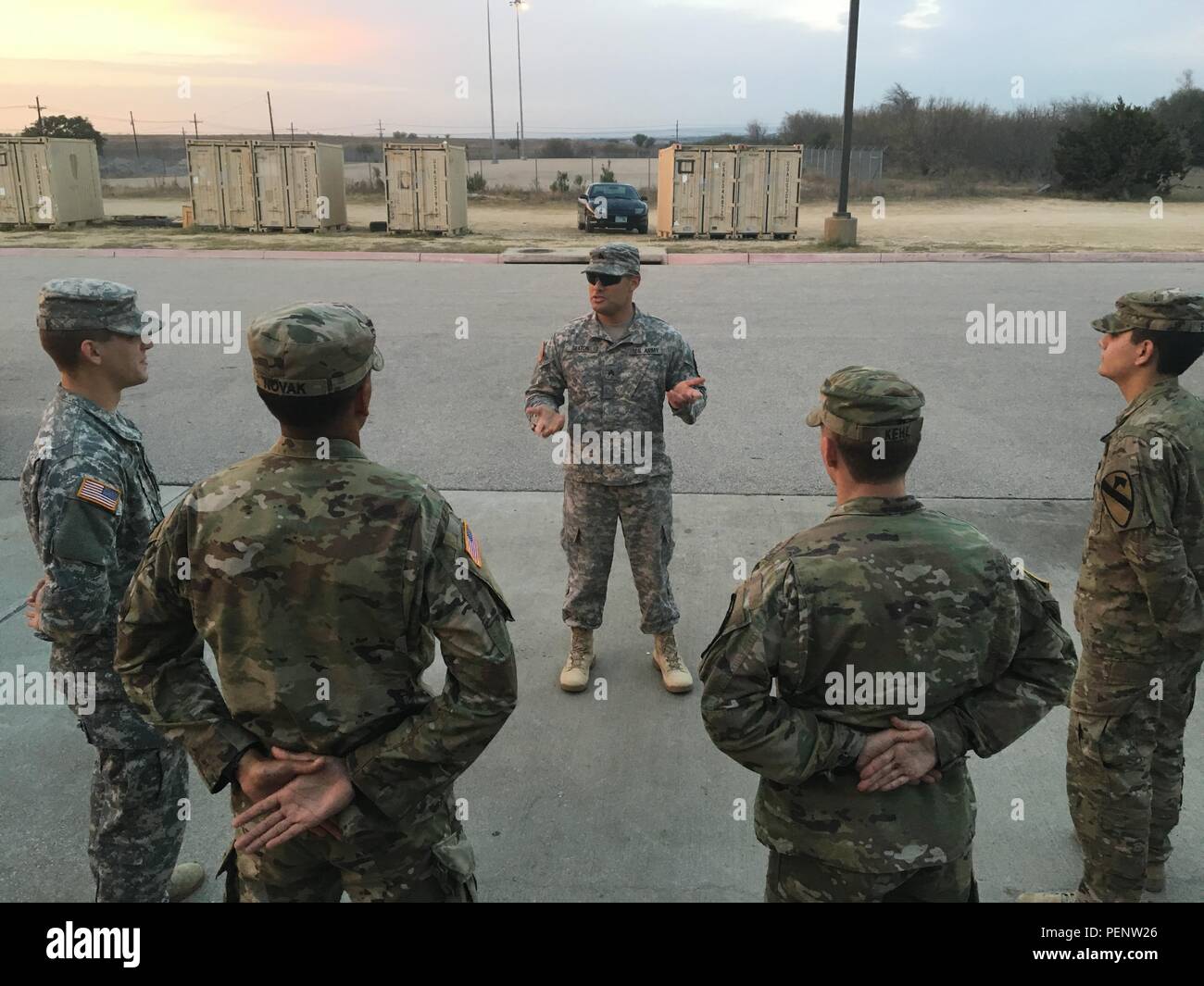 Sgt. Joseph Sexton (center), squad leader, Headquarters and ...