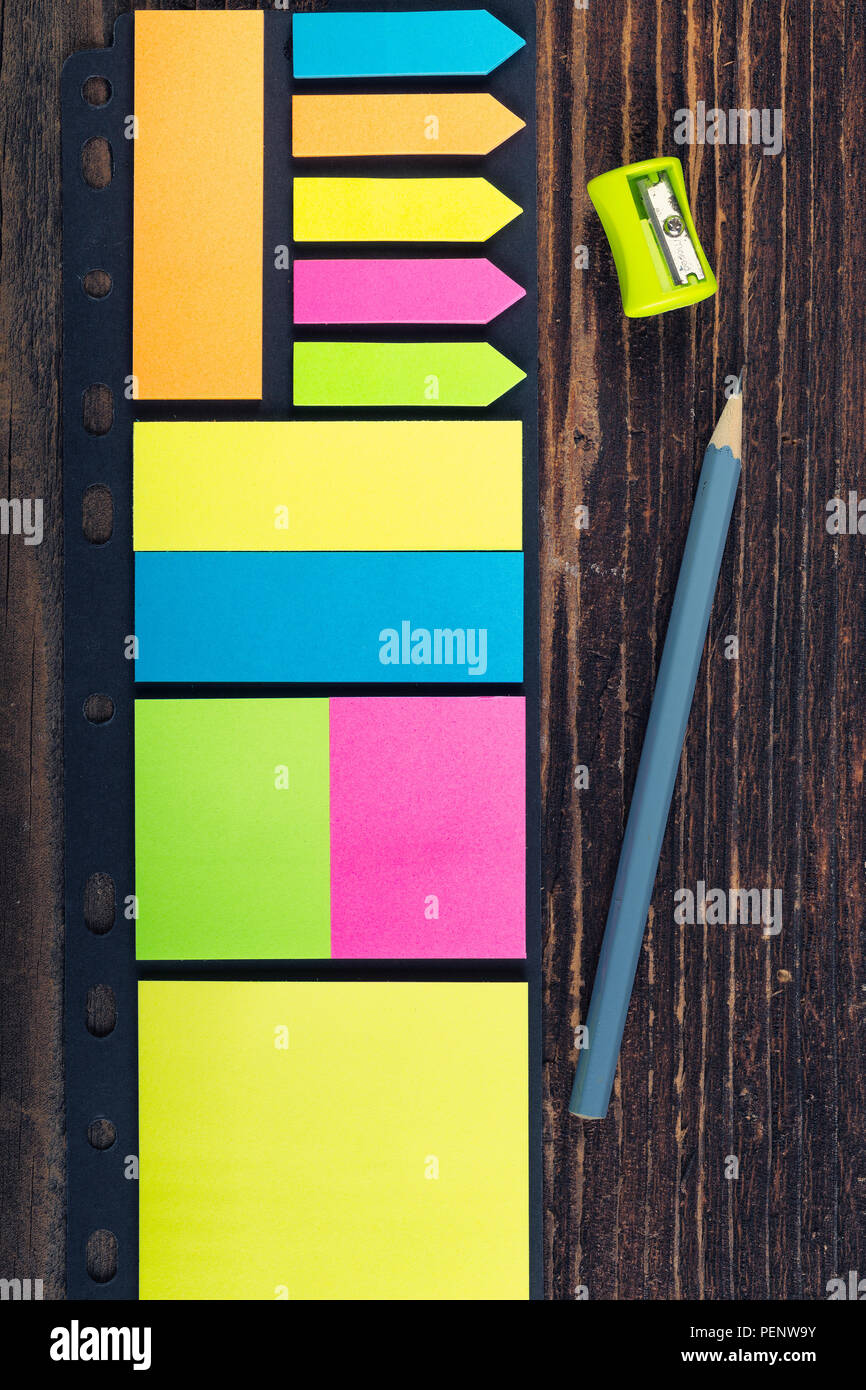 Bunch of colored sticky notes on the wooden background Stock Photo - Alamy