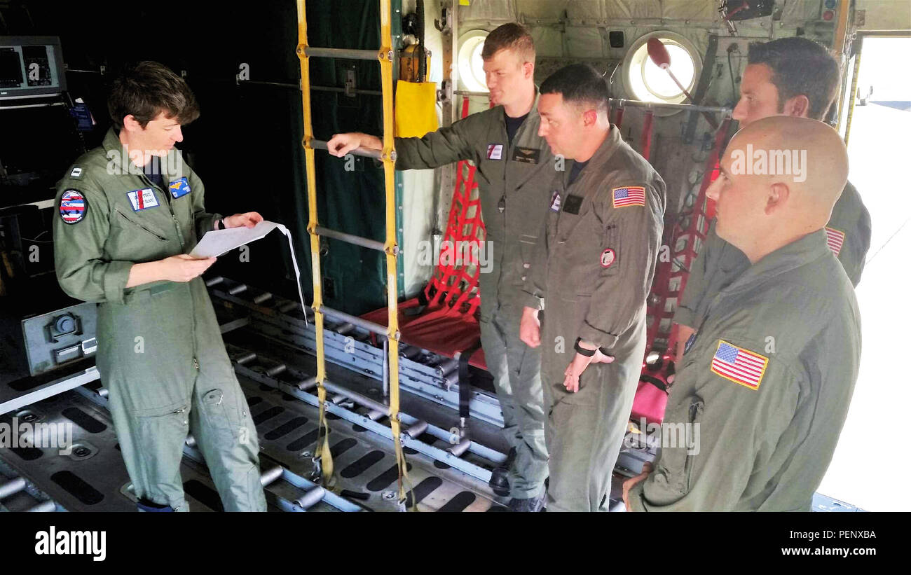 The crew of a Coast Guard HC-130 Hercules airplane (CG 1707) from Air ...