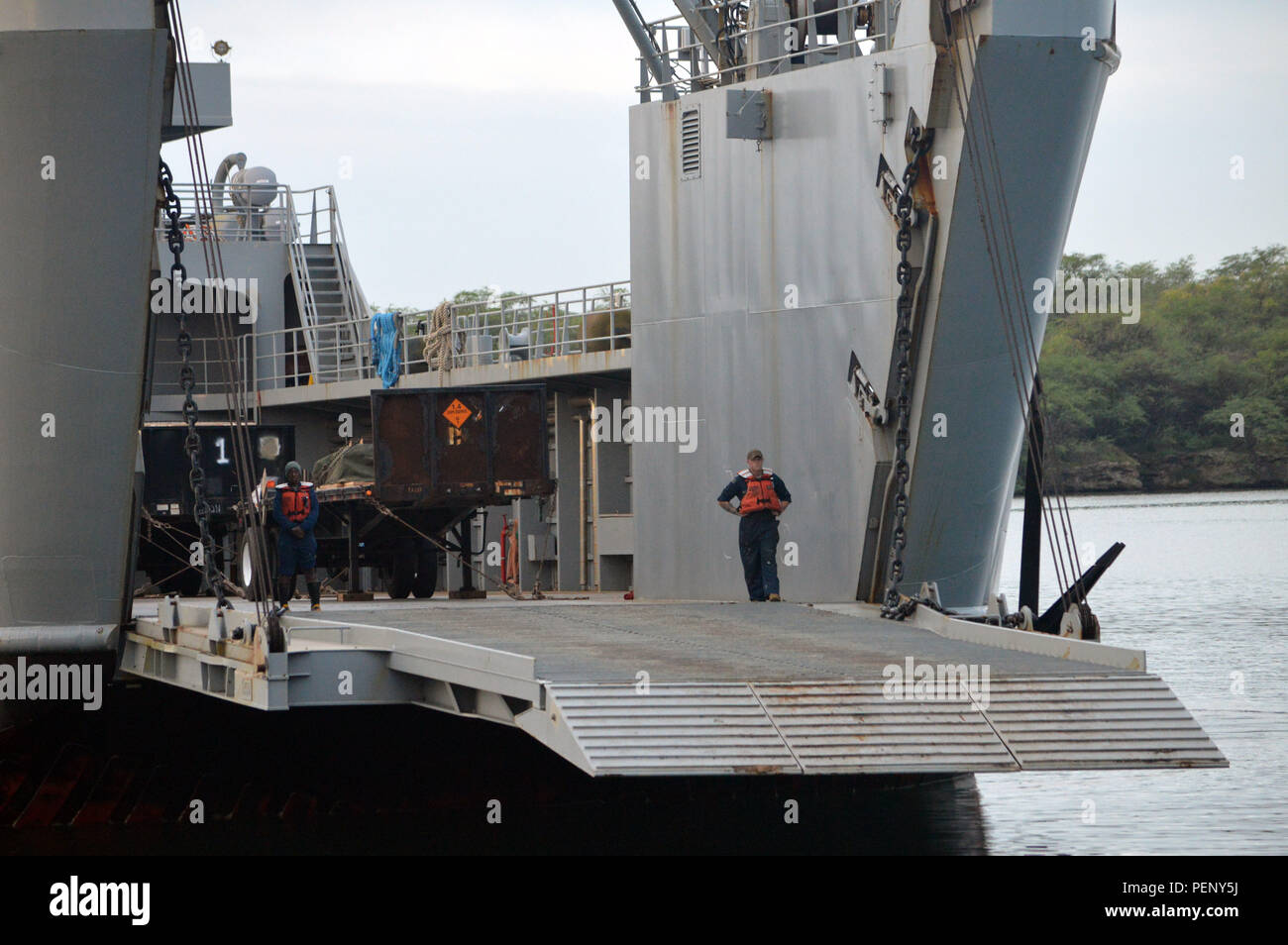 Crew members of the U.S. Army logistics support vessel USAV CW3 Harold ...