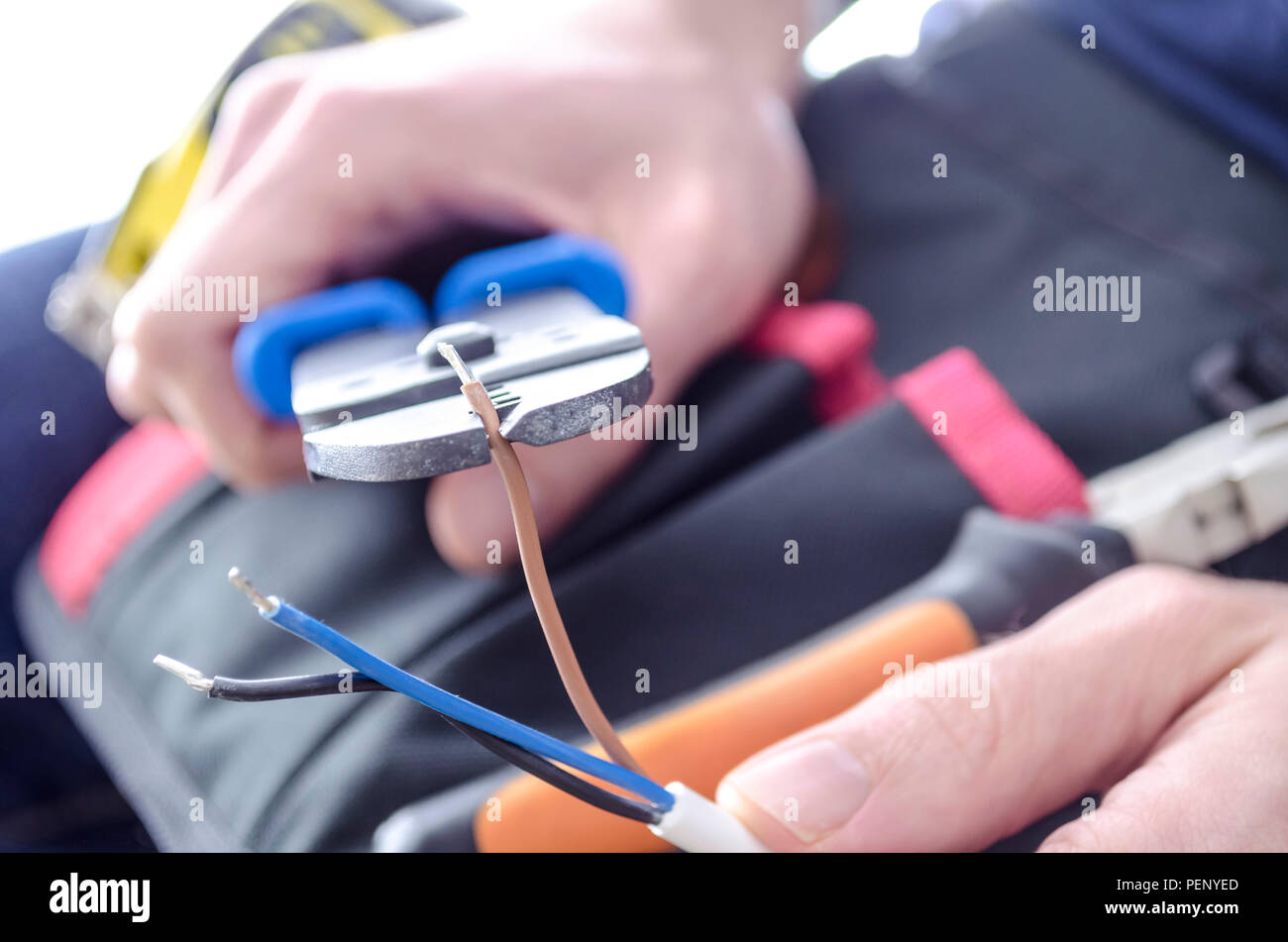 Closeup of worker's hands cutting electric wires with pliers Stock ...