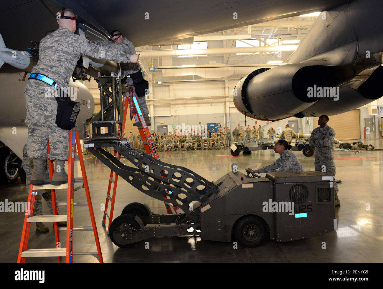 The 20th Aircraft Maintenance Unit Viper 3 load crew secures a GBU-38 ...