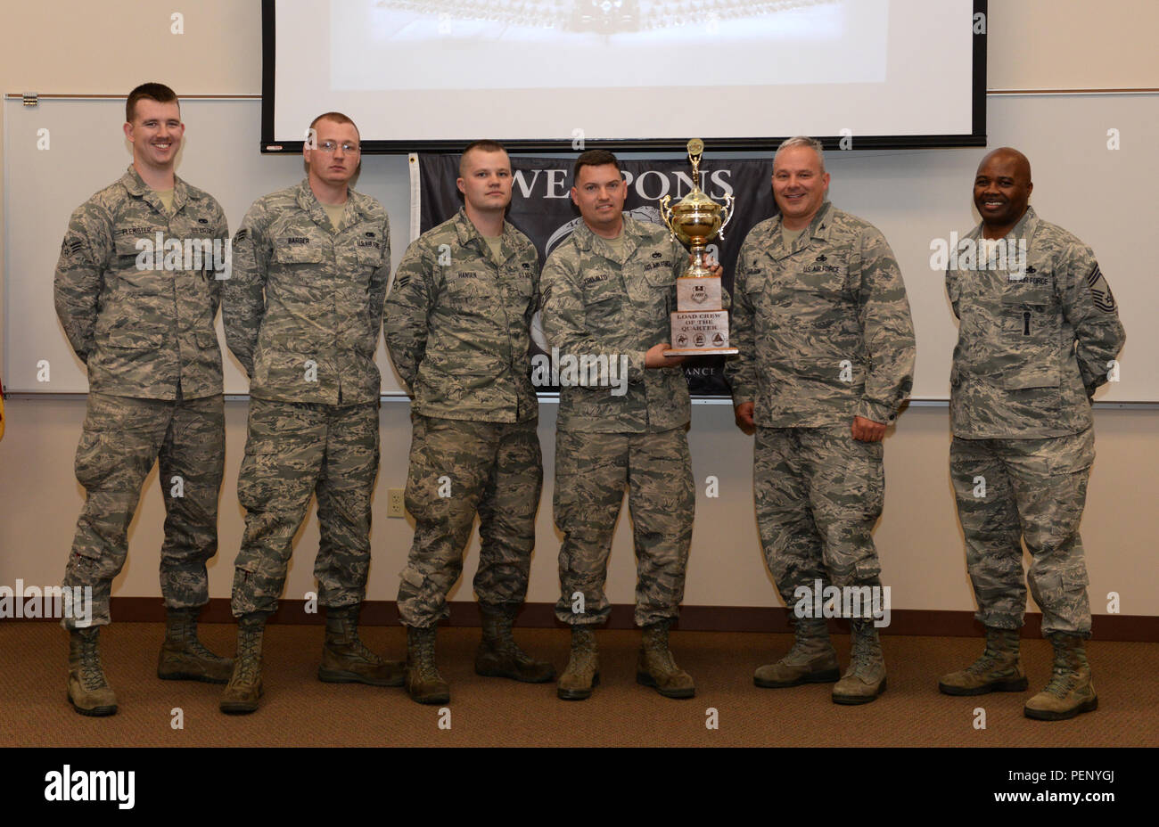 The 96th Aircraft Maintenance Unit’s Cobra 7 load crew poses for a ...