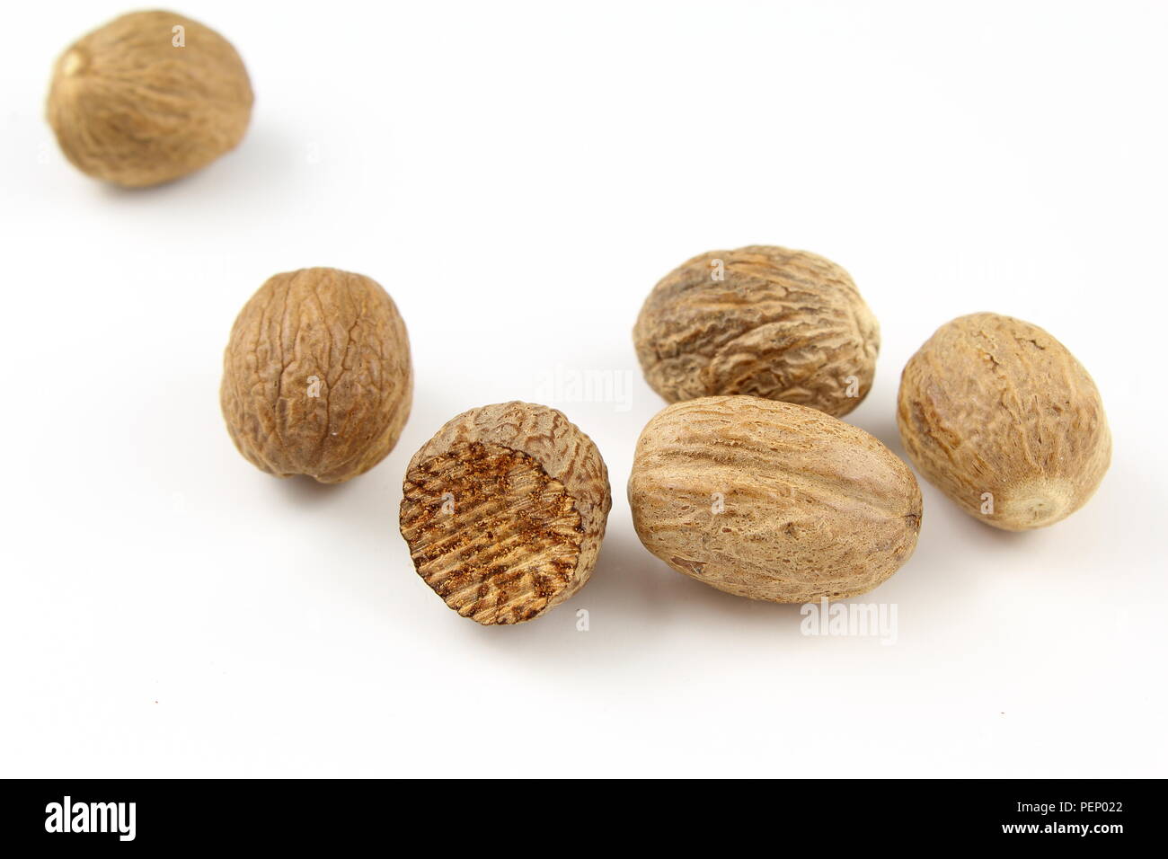 composition of nutmeg seeds isolated on a white background Stock Photo ...