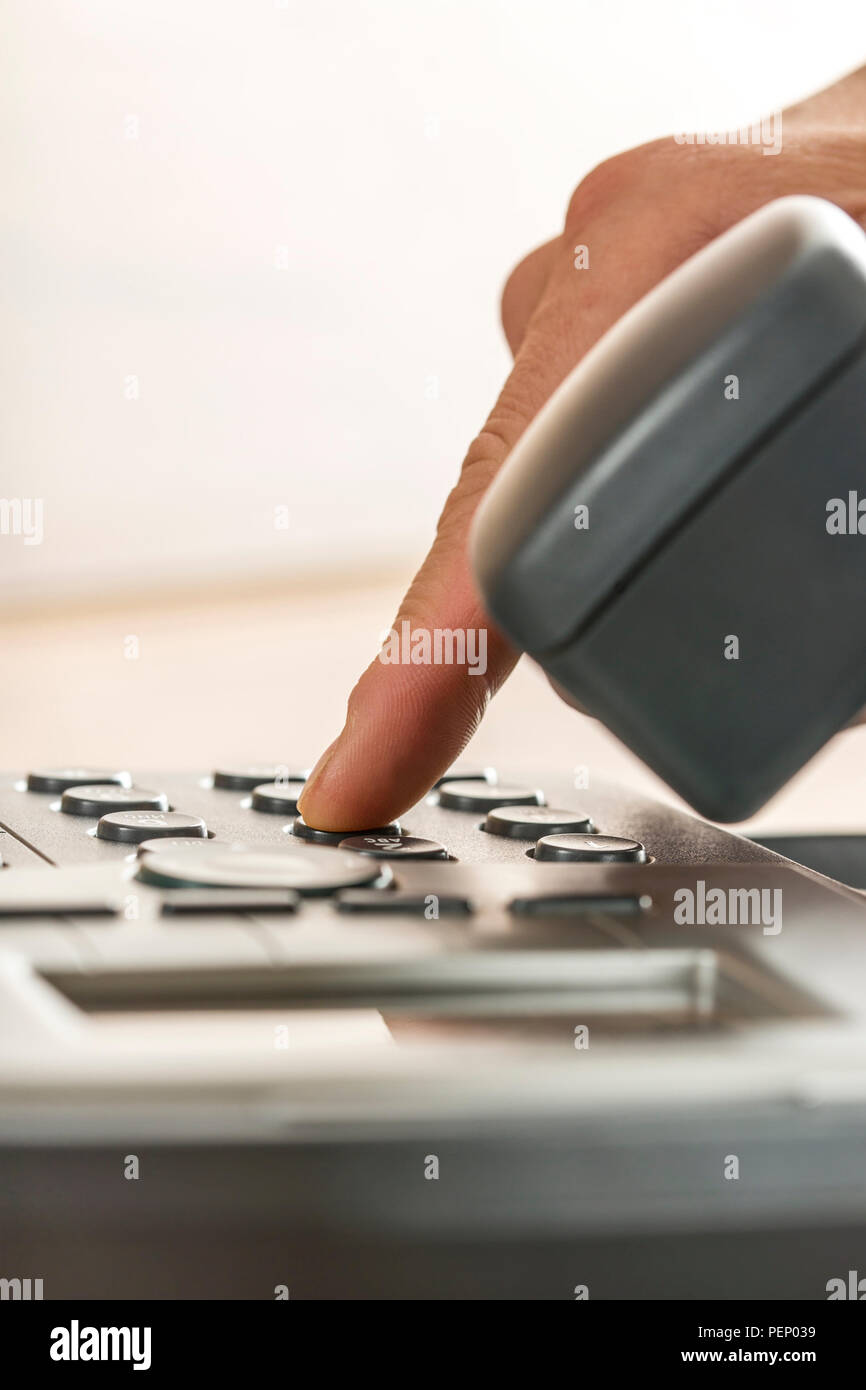 Closeup of a male hand making a phone call by dialing a classical ...
